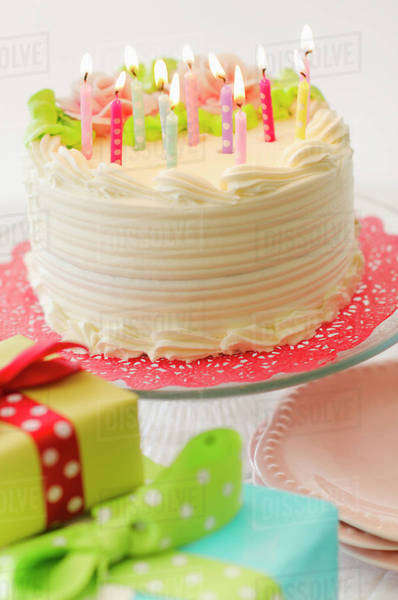 Studio shot of colorful birthday cake and birthday gifts - Royalty-free ...
