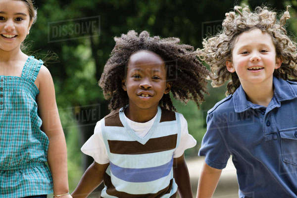 Smiling children holding hands and running - Royalty-free Stock Photo ...
