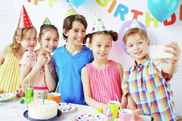 Row of happy kids making selfie at birthday party - Royalty-free Stock ...