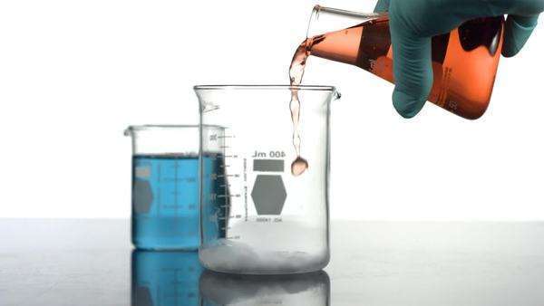 Liquid being poured into beaker. Slow motion. - Stock Video Footage ...