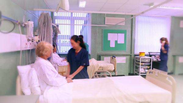 Timelapse of medical staff taking care of patients on a busy hospital ...