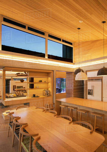 Illuminated wood ceiling over kitchen and dining table - Royalty-free ...