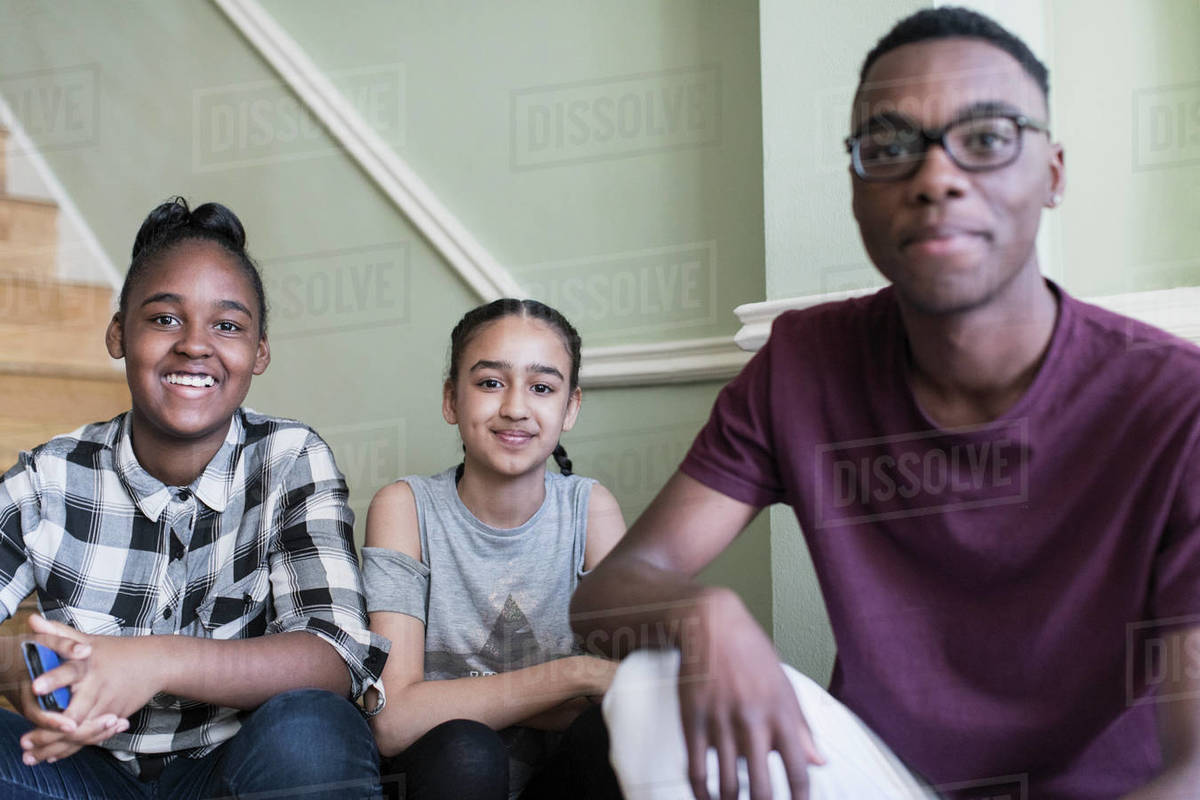 Portrait confident tween siblings - Royalty-free Stock Photo | Dissolve