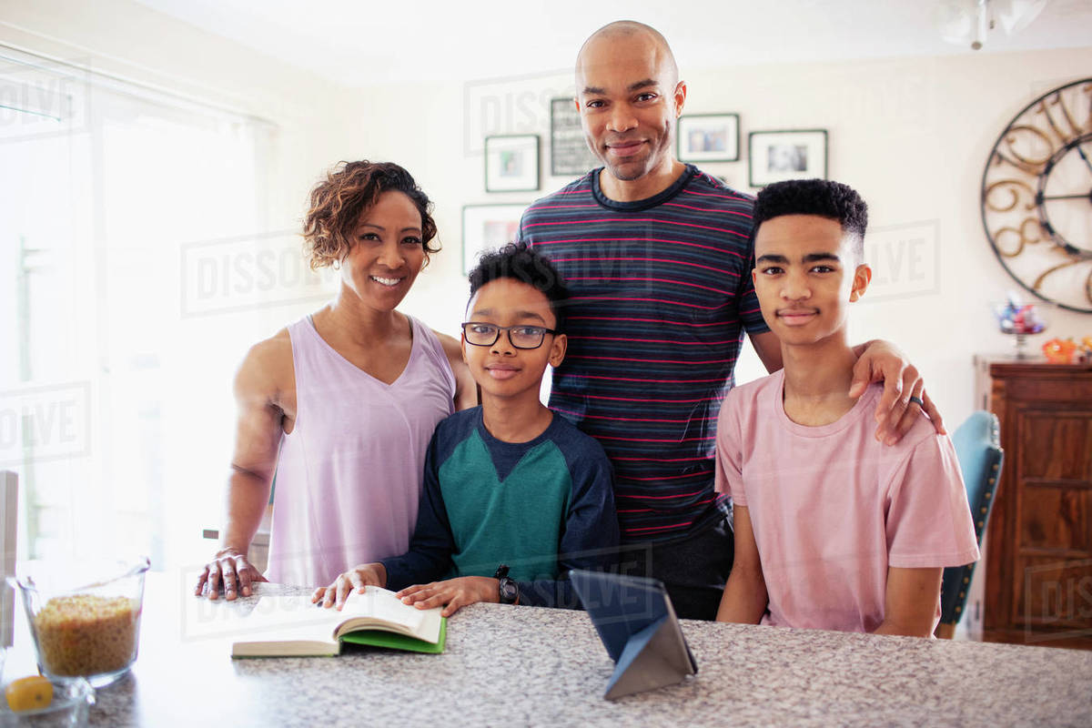 Portrait smiling family in kitchen - Royalty-free Stock Photo | Dissolve