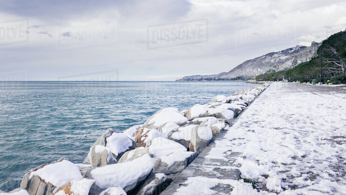 Snow-covered promenade in Trieste, Italy - Stock Photo - Dissolve