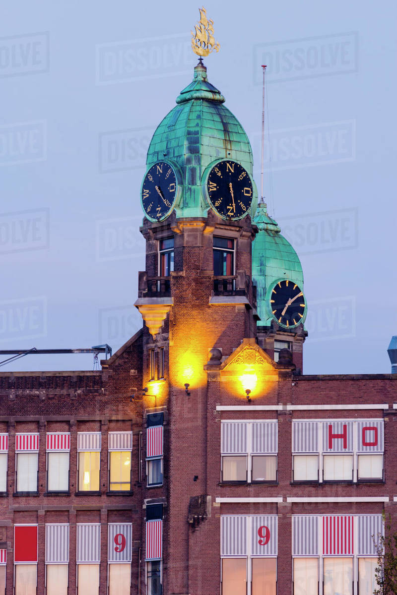 Netherlands, Rotterdam, Tower with weather vane - Stock Photo - Dissolve