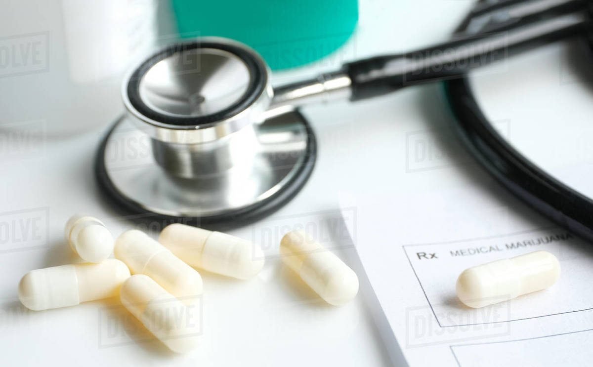 Medical marijuana capsules and stethoscope with doctor's prescription ...