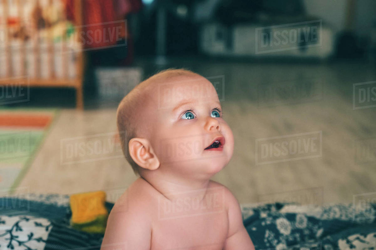 Baby girl looking up - Royalty-free Stock Photo | Dissolve