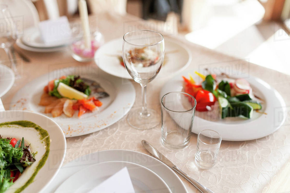 Drinking glasses and food on dining table during wedding - Stock Photo ...