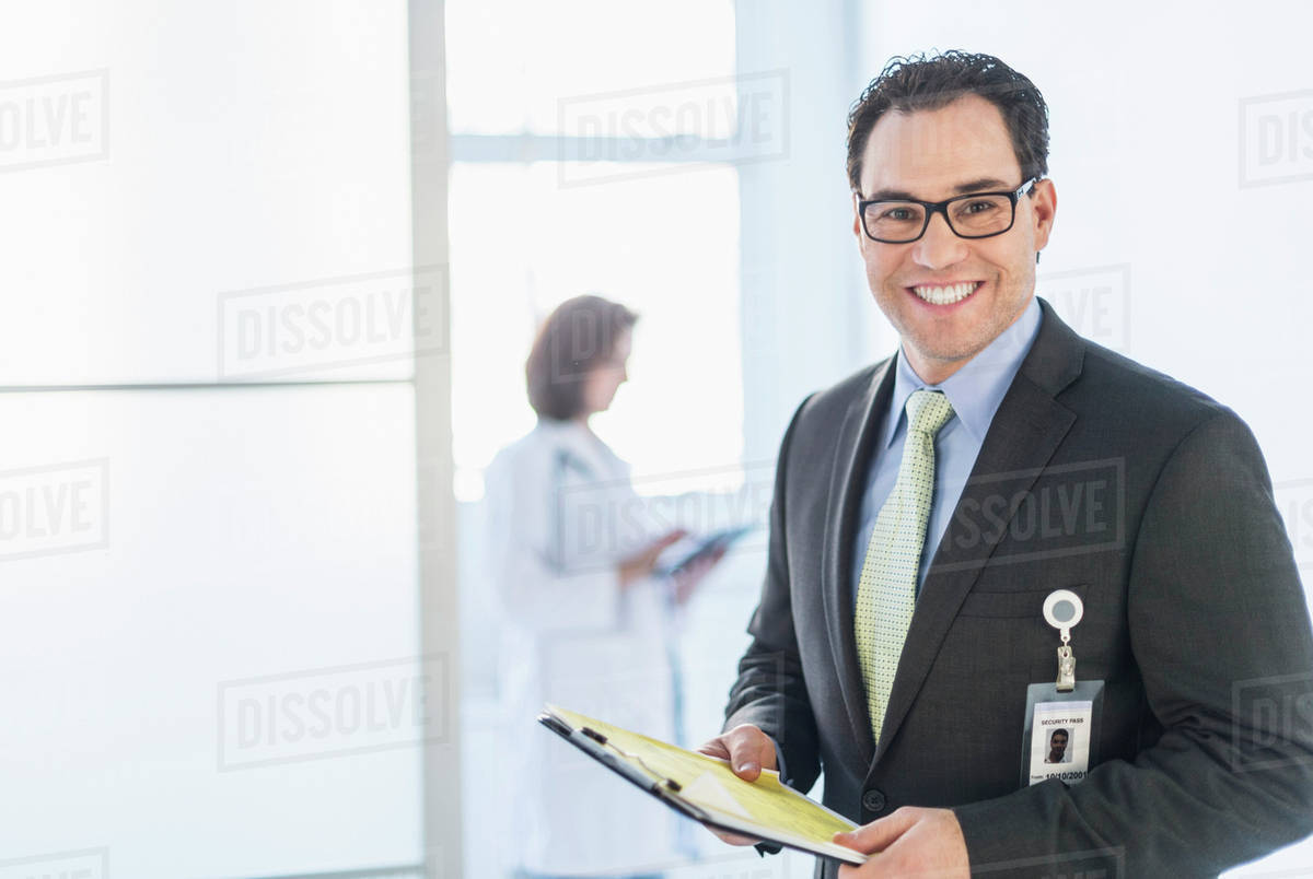 Portrait of health administrator in hospital - Stock Photo - Dissolve