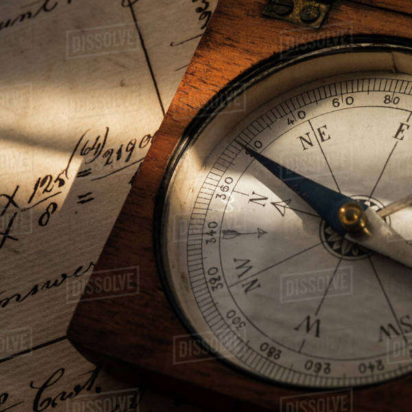 Studio shot of old fashioned compass - Stock Photo - Dissolve