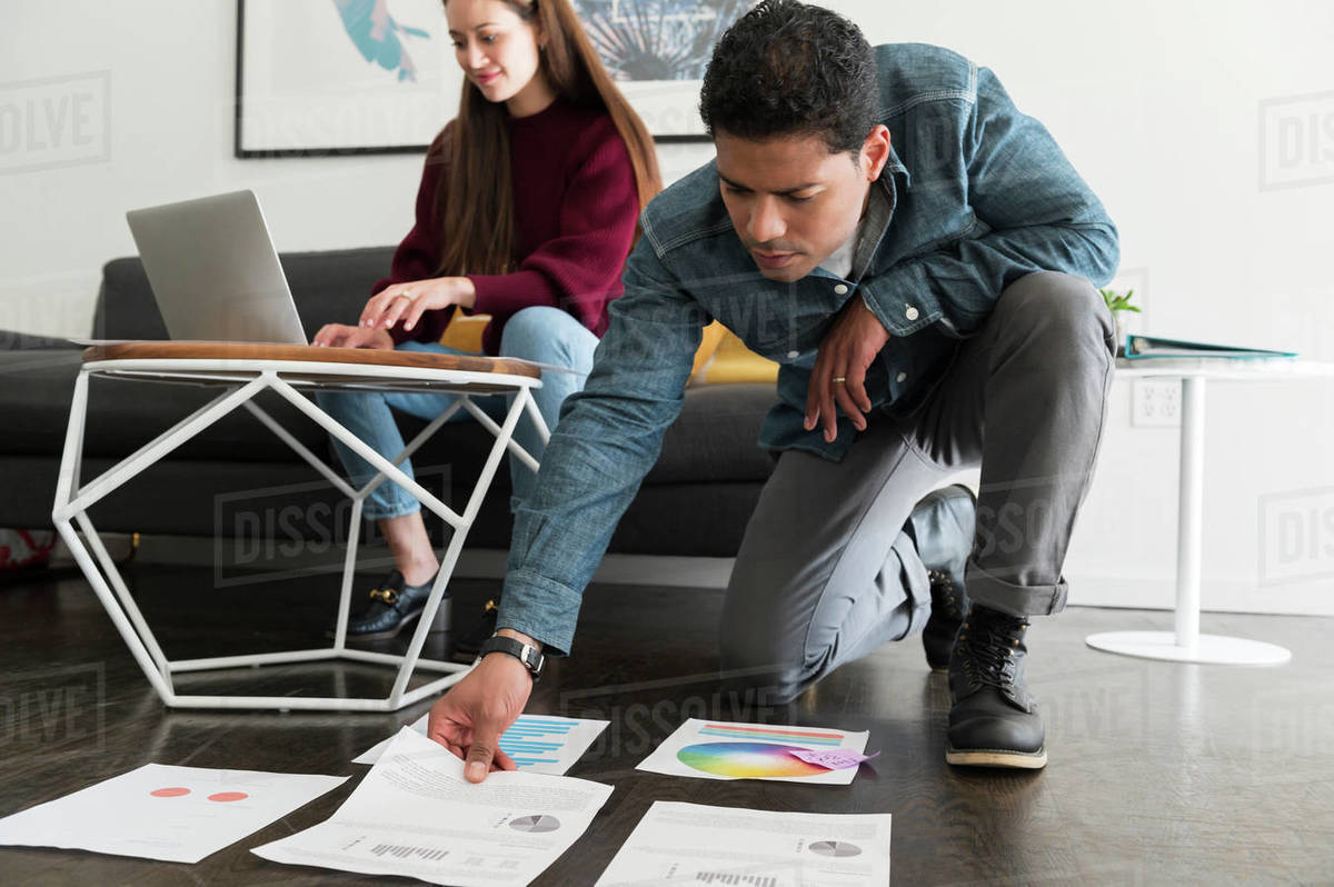 Business people working on strategy in office - Stock Photo - Dissolve