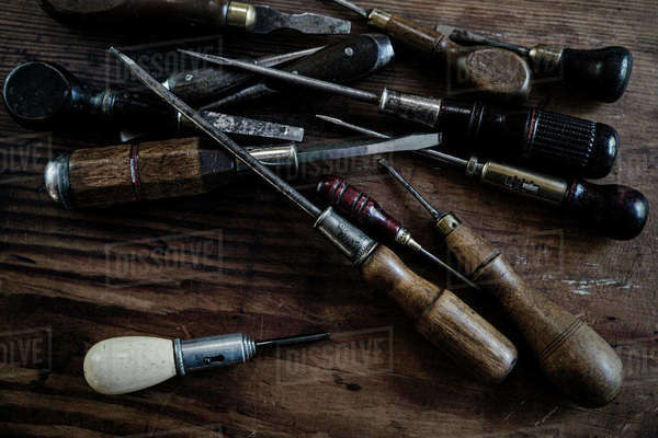 Variety of screwdrivers on wooden table - Stock Photo - Dissolve