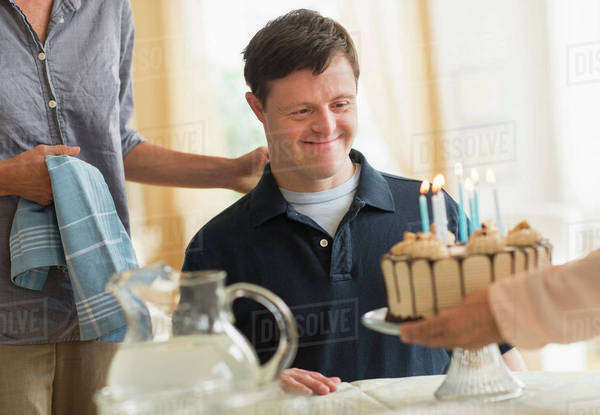 Man with down syndrome celebrating birthday - Royalty-free Stock Photo ...