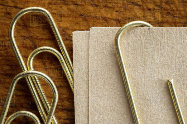 Close up of paper clips and paper - Royalty-free Stock Photo | Dissolve