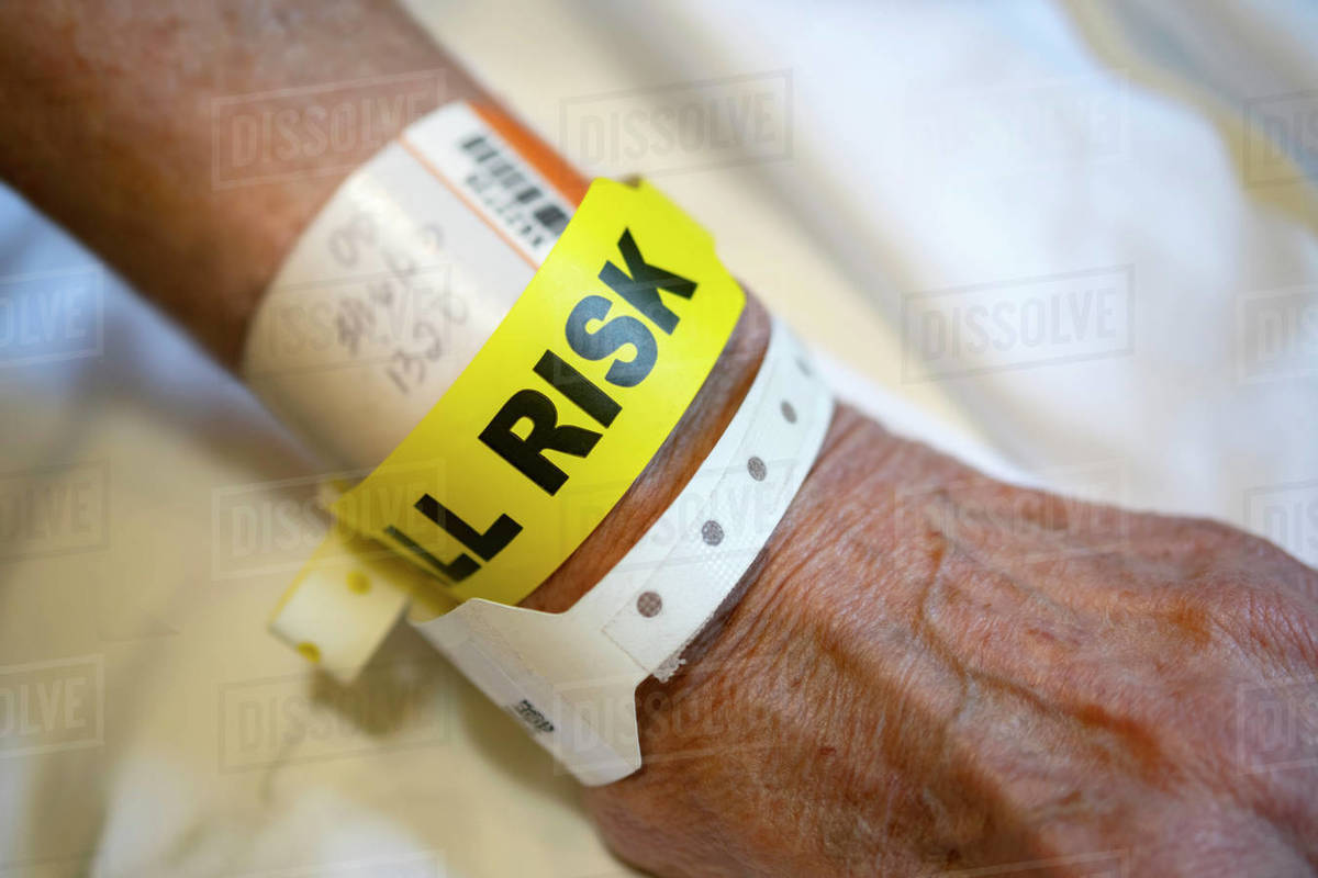 'Fall risk' tag around senior person's wrist - Royalty-free Stock Photo ...