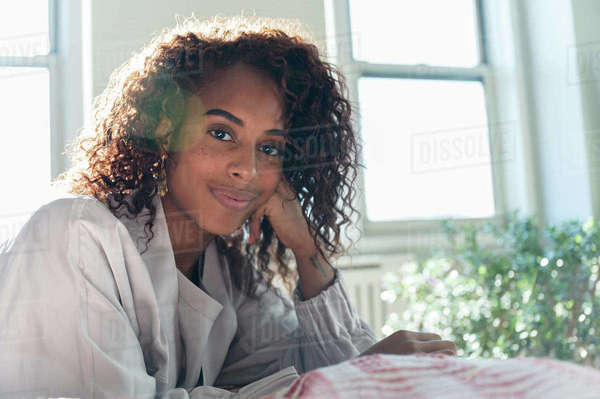 Woman leaning on her hand - Royalty-free Stock Photo | Dissolve