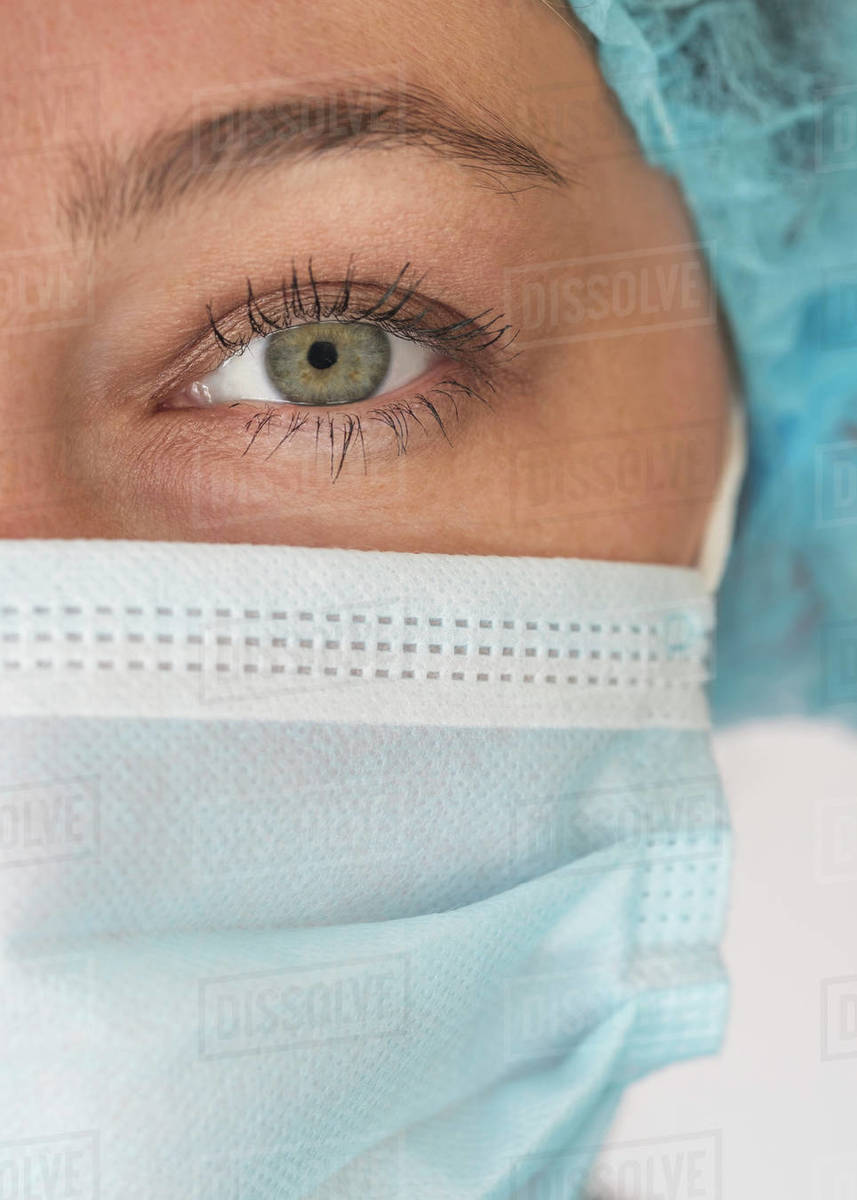 Portrait of nurse in face mask - Stock Photo - Dissolve