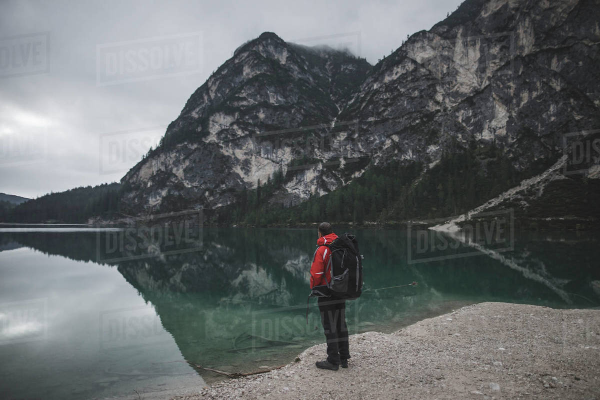 Italy, Pragser Wildsee, Dolomites, South Tyrol, Man looking at view ...
