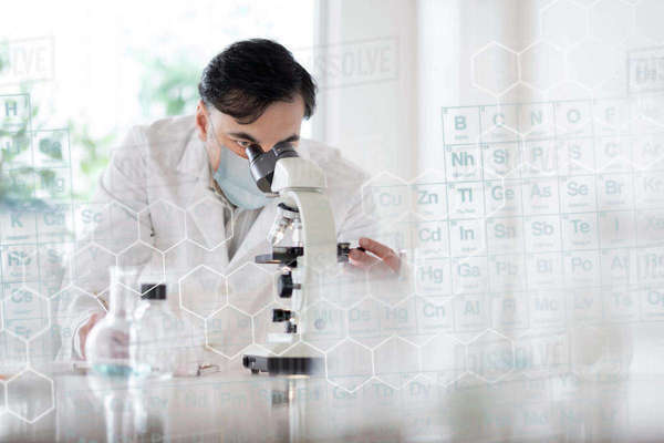 Doctor using microscope - Royalty-free Stock Photo | Dissolve