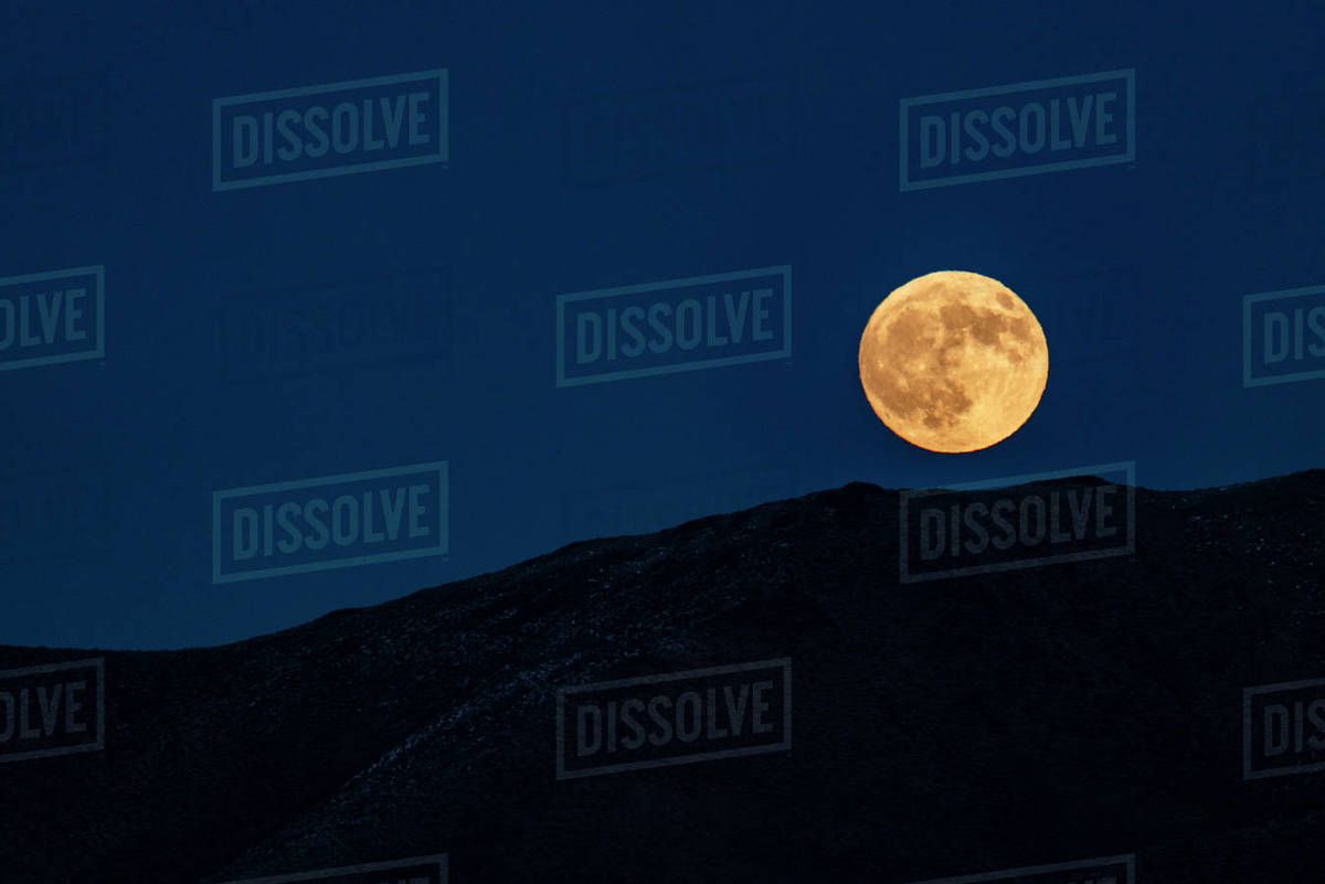 USA, Idaho, Bellevue, Full moon rising over hills - Royalty-free Stock ...