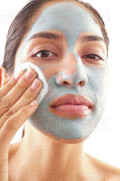 Close-up of woman removing blue facial mask - Royalty-free Stock Photo ...