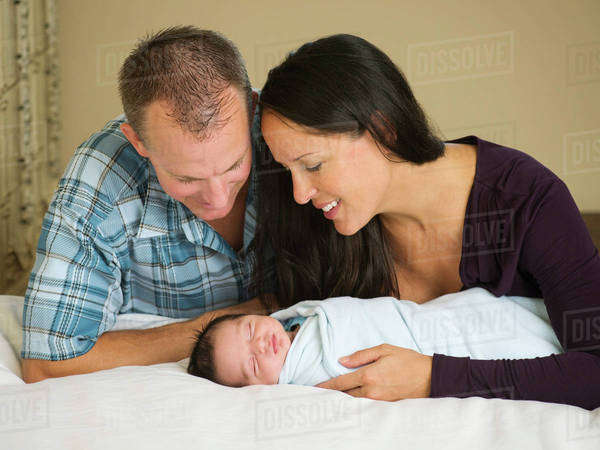 Portrait of family with newborn baby boy (0-11 months) - Stock Photo ...