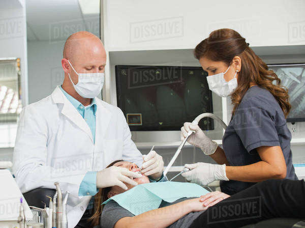 Dentist operation on patient - Royalty-free Stock Photo | Dissolve