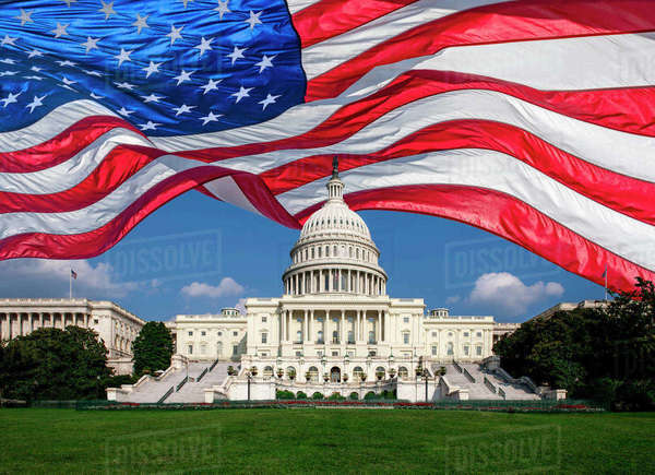 American flag waving over Capital Building - Royalty-free Stock Photo ...