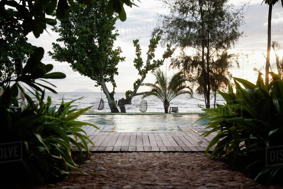 Cambodia, Hotel swimming pool overlooking ocean - Royalty-free Stock ...