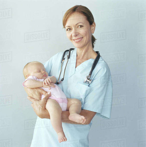 Portrait of doctor holding baby girl (2-5 months) - Royalty-free Stock ...