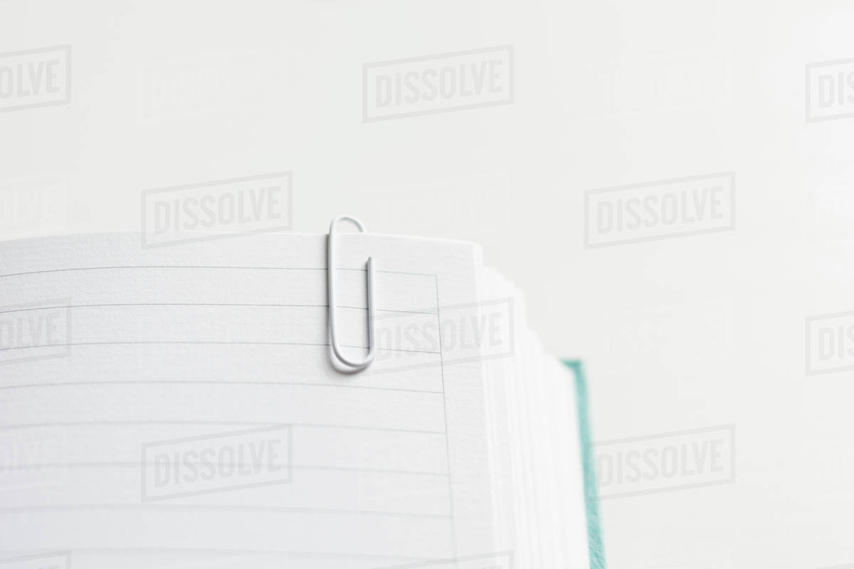 Open and empty journal with paper clip attached - Royalty-free Stock ...