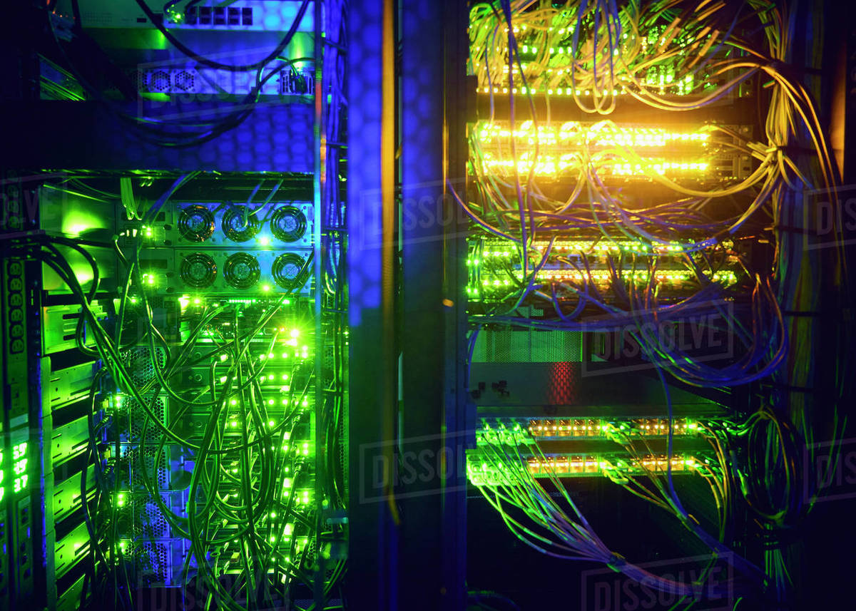 Illuminated network cables in server room - Stock Photo - Dissolve