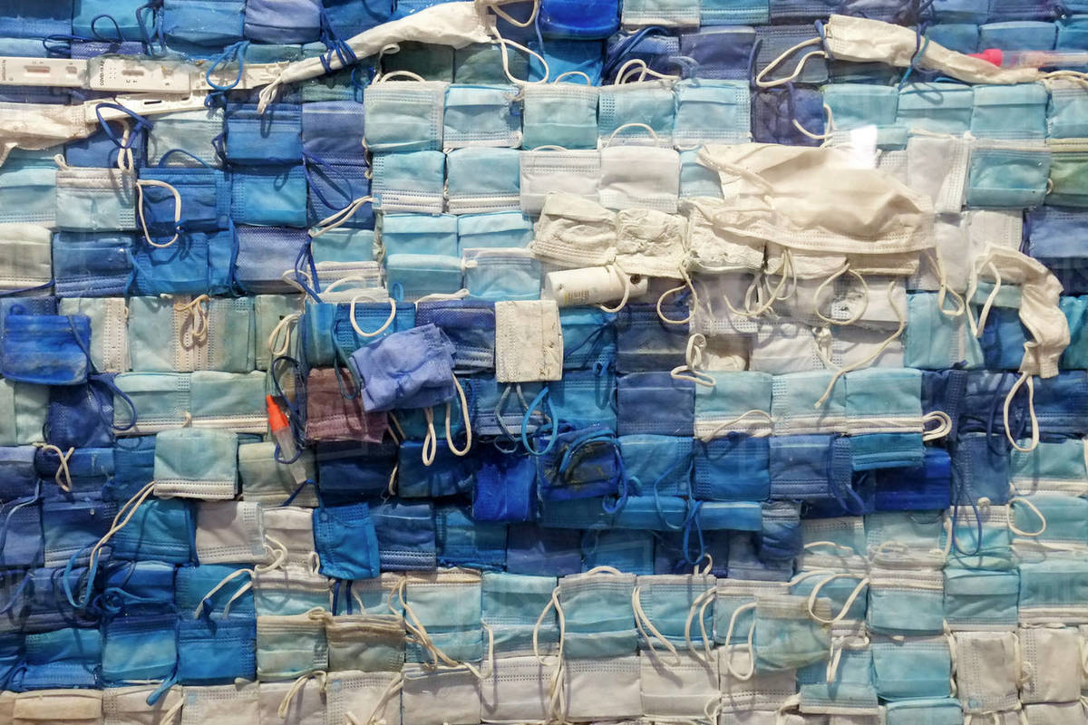 Wall of recycled face masks - Stock Photo - Dissolve