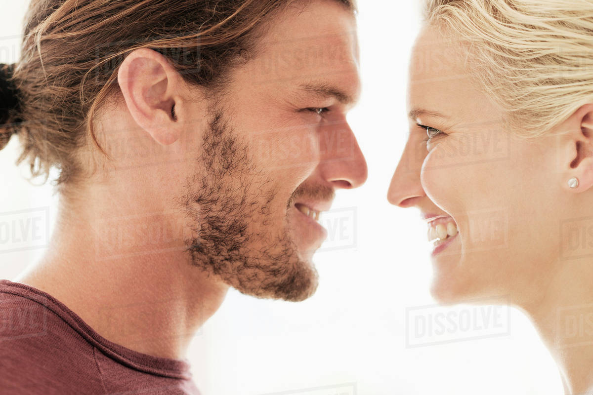 Couple face to face on white background - Stock Photo - Dissolve