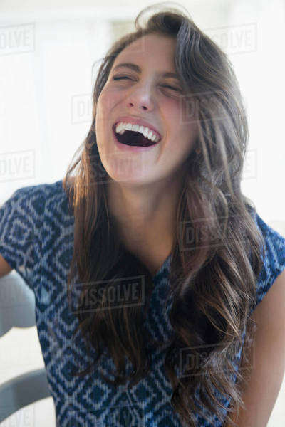 Woman laughing - Stock Photo - Dissolve