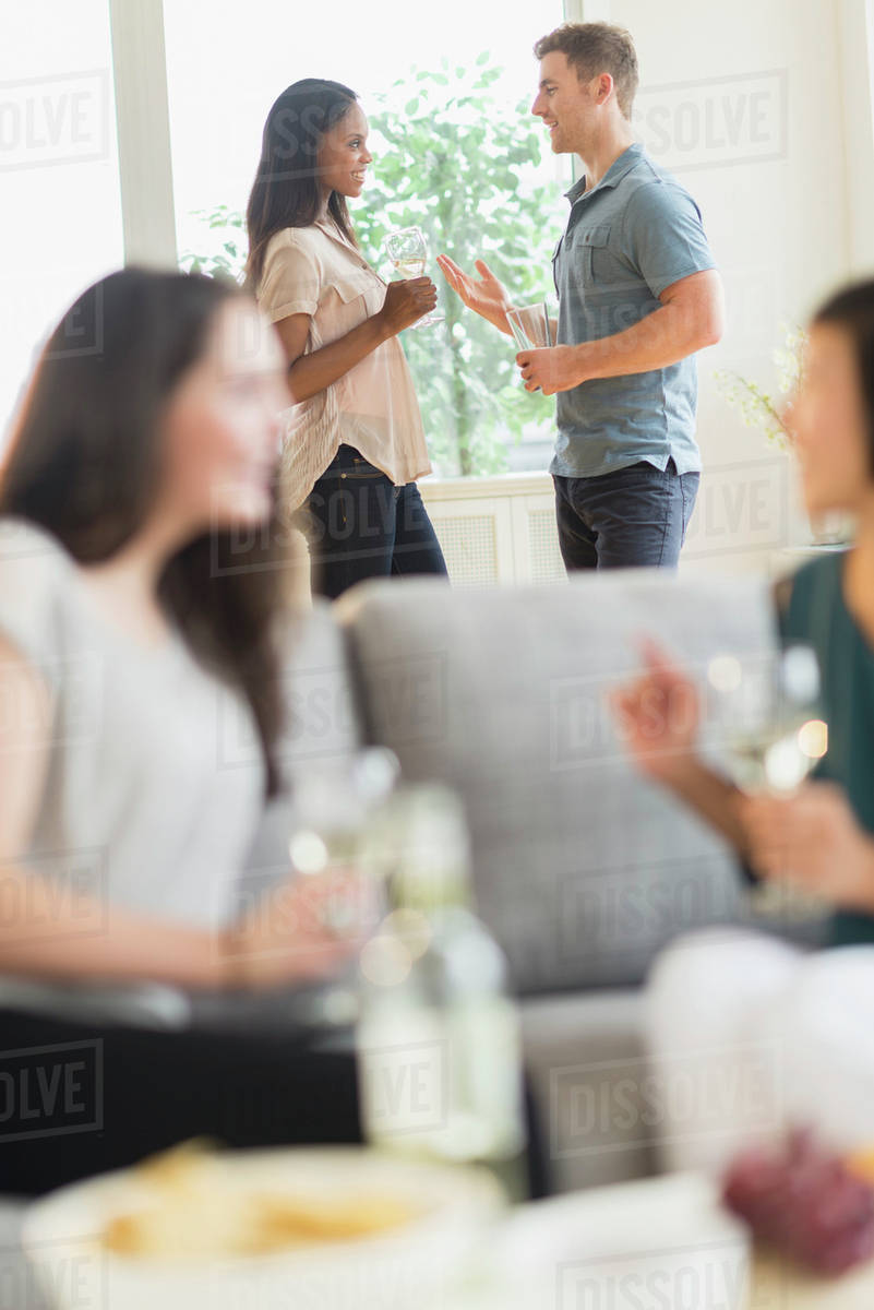 People talking at party - Royalty-free Stock Photo | Dissolve