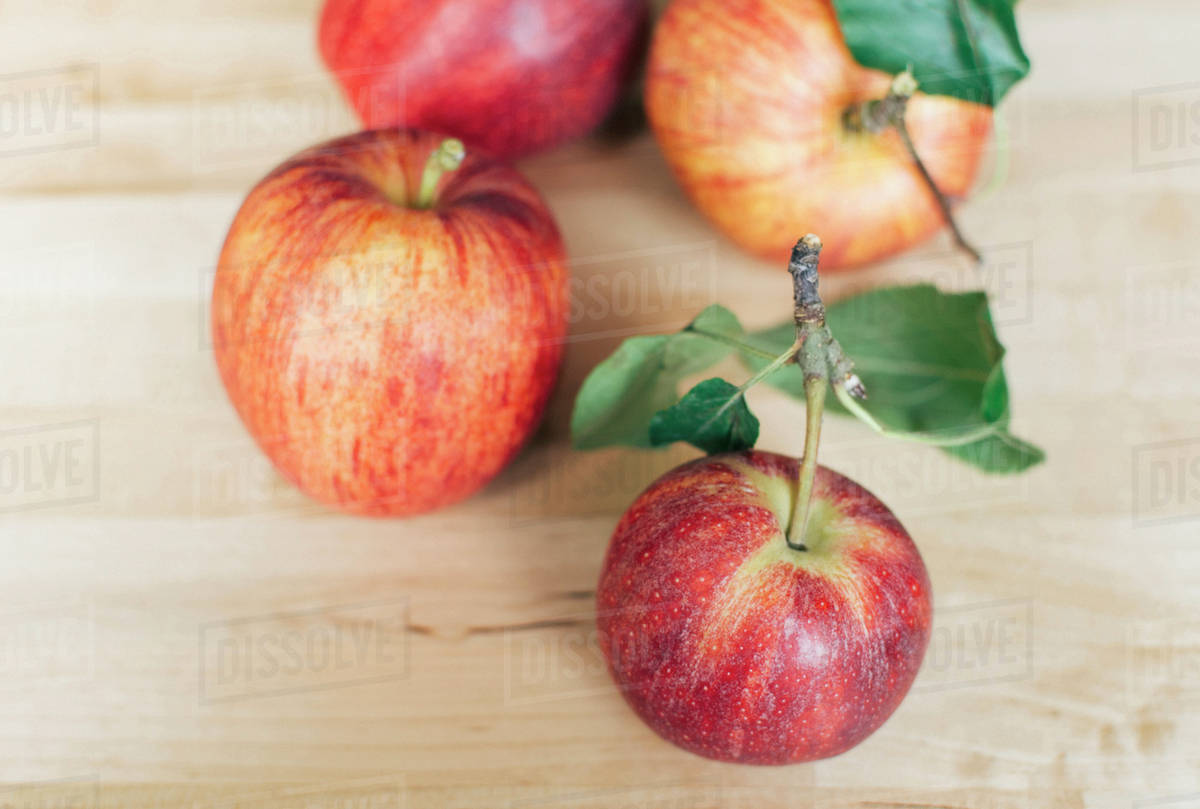Four red apples - Royalty-free Stock Photo | Dissolve