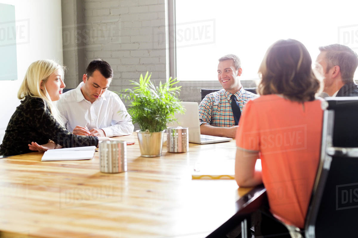 Five office workers during meeting - Stock Photo - Dissolve