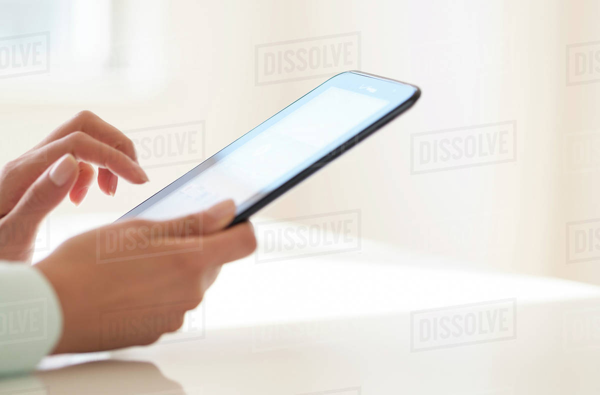 Hands using tablet pc - Royalty-free Stock Photo | Dissolve