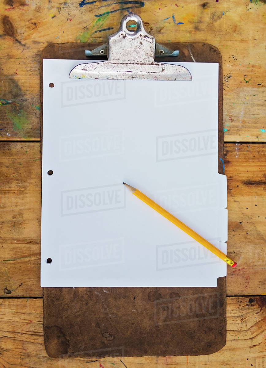 Pencil and clipboard with blank paper - Royalty-free Stock Photo | Dissolve