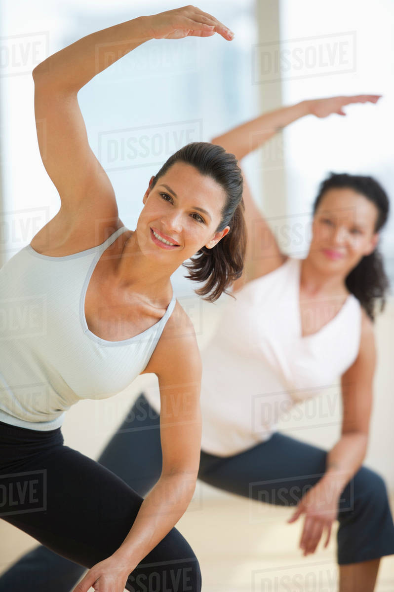 Two women exercising in gym - Royalty-free Stock Photo | Dissolve
