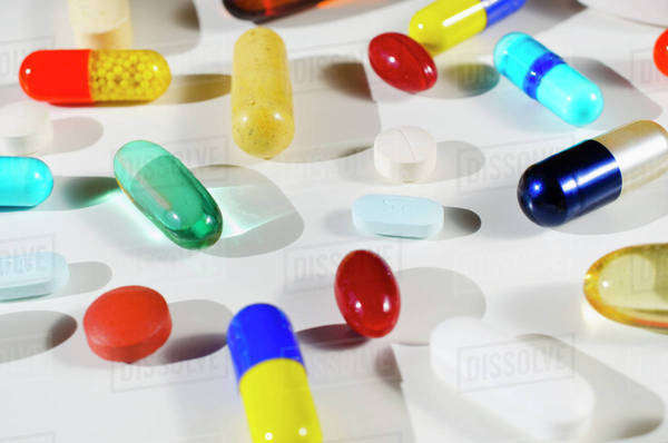 Studio shot of various pills and capsules - Stock Photo - Dissolve