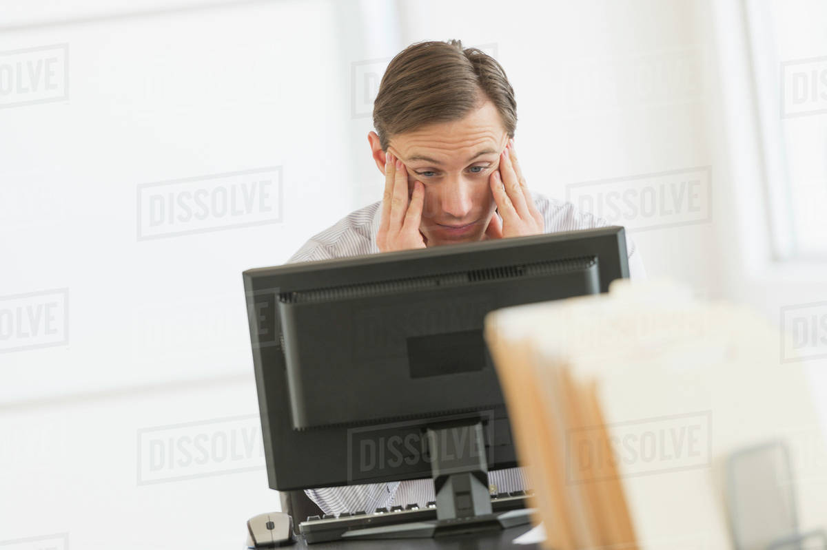 Office worker using computer - Royalty-free Stock Photo | Dissolve