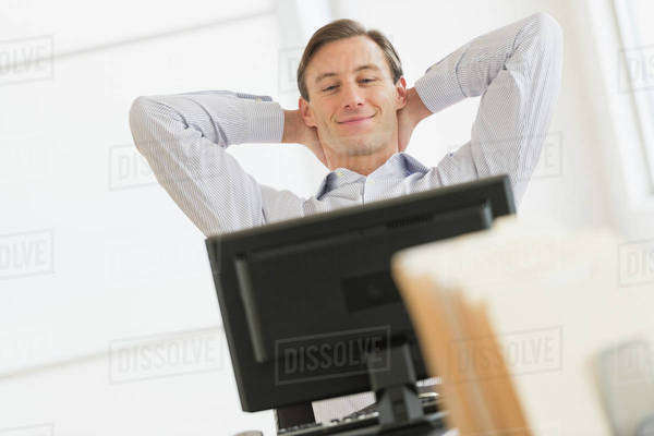 Office worker using computer - Royalty-free Stock Photo | Dissolve