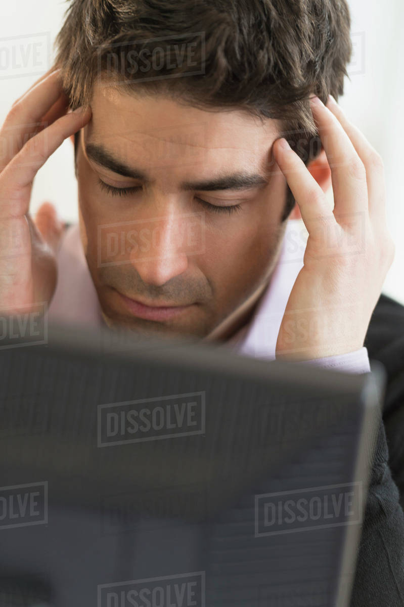 Business man with head in hands - Royalty-free Stock Photo | Dissolve