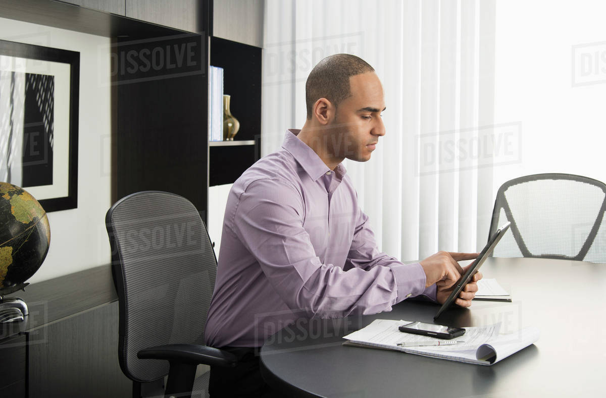 Male executive working at desk in office - Royalty-free Stock Photo ...