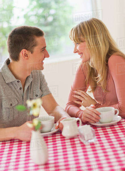 Couple sitting at table - Royalty-free Stock Photo | Dissolve