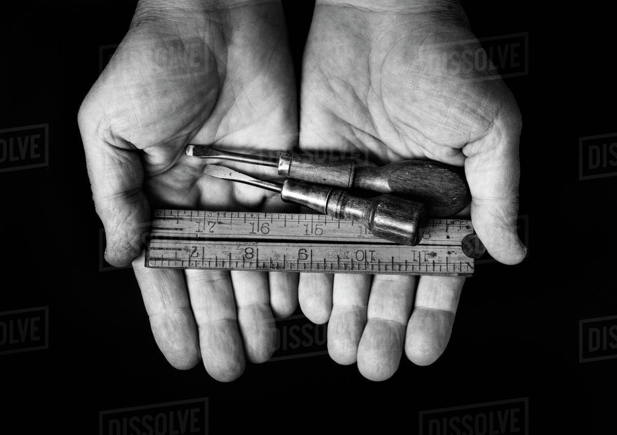 Studio shot of hands holding antique tools - Royalty-free Stock Photo ...