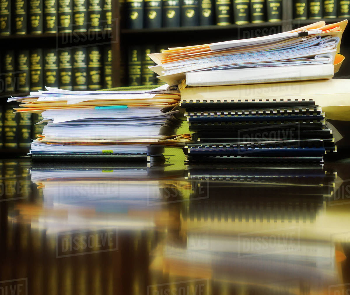 Stack of books and files on table - Royalty-free Stock Photo | Dissolve